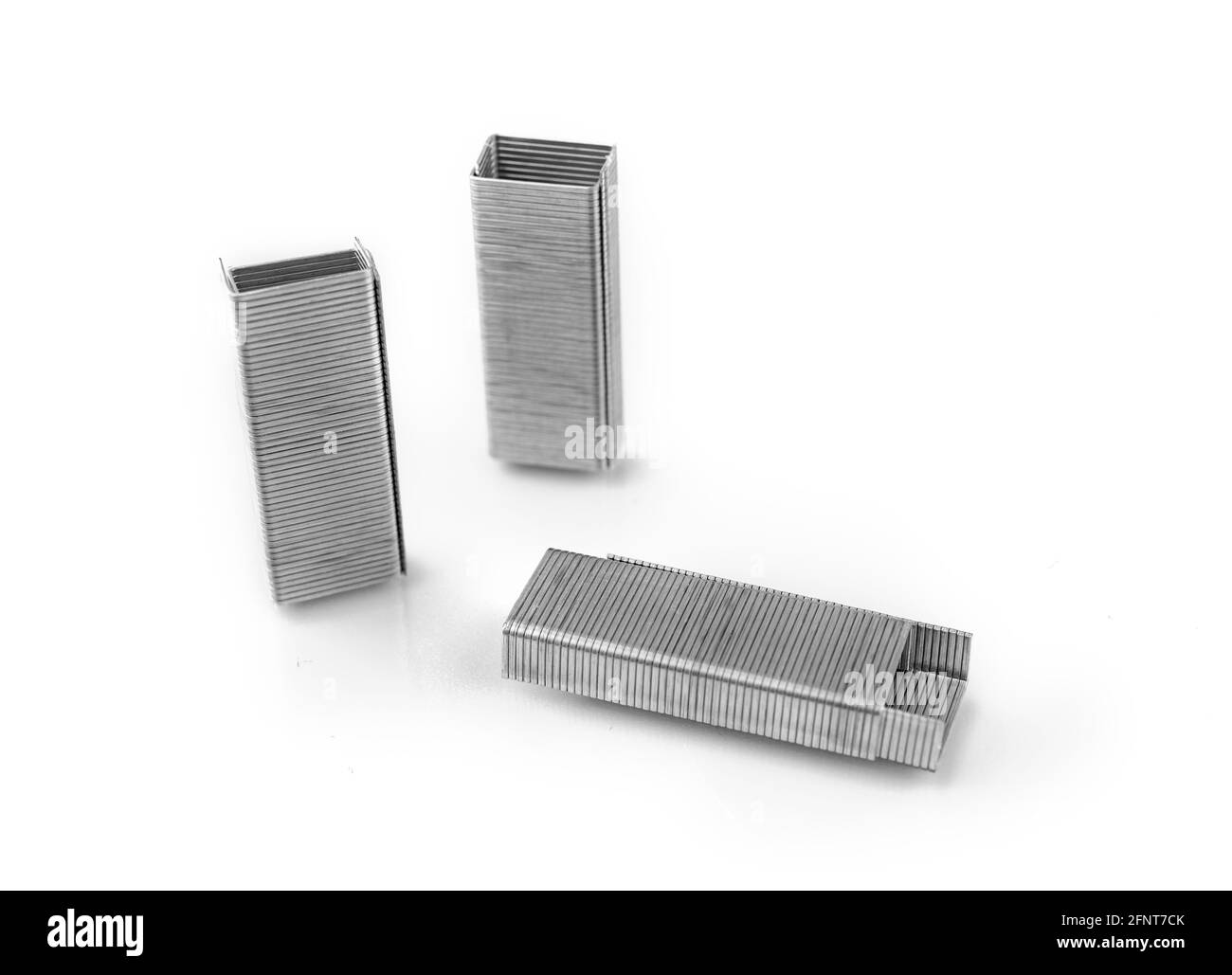 Stapler staples in form of buildings isolated on white background ...