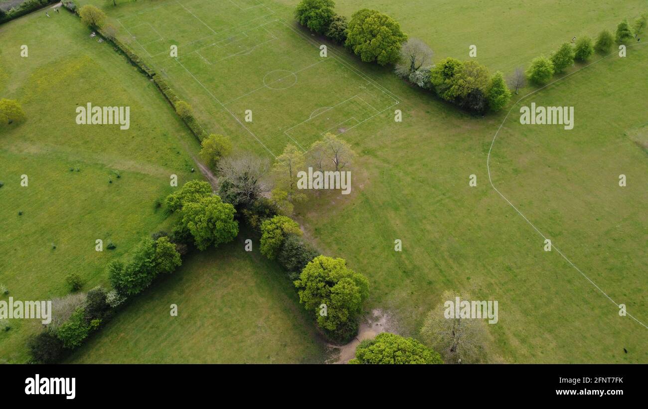 An aerial view looking from directly above of green fields and hedges ...