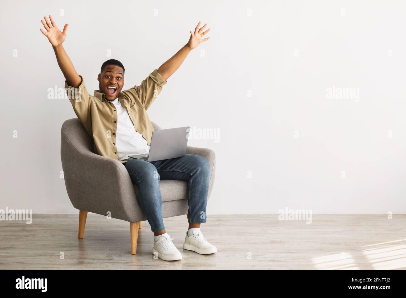 Black Man With Laptop Raising Hands In Joy, Gray Background Stock Photo ...