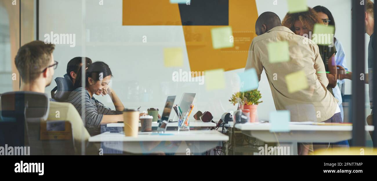 Young professionals working on task solution together Stock Photo - Alamy