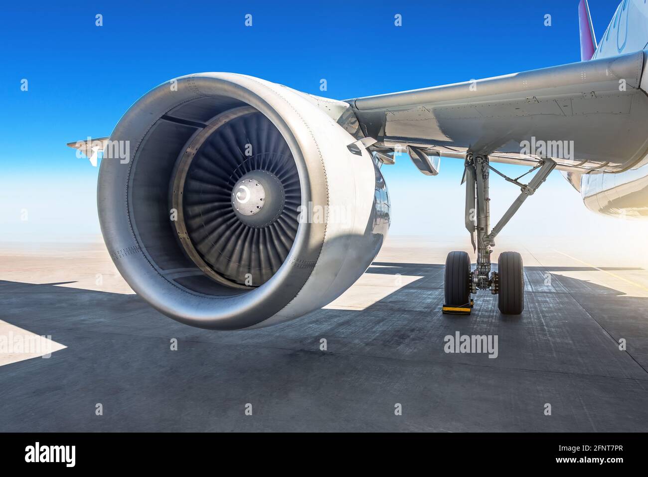 Wing jet engine of the airplane at the airport apron Stock Photo - Alamy