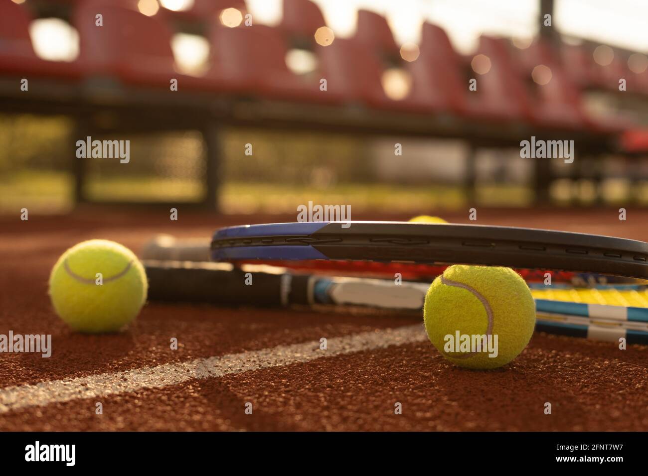 Close up view of two tennis rackets and balls on the tennis court Stock ...