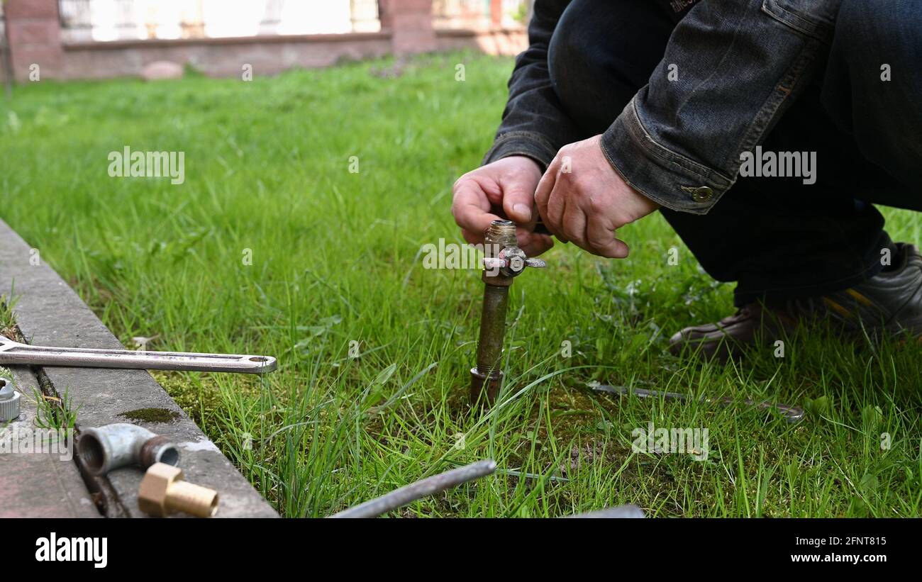 Repairing the street water pipe Stock Photo - Alamy