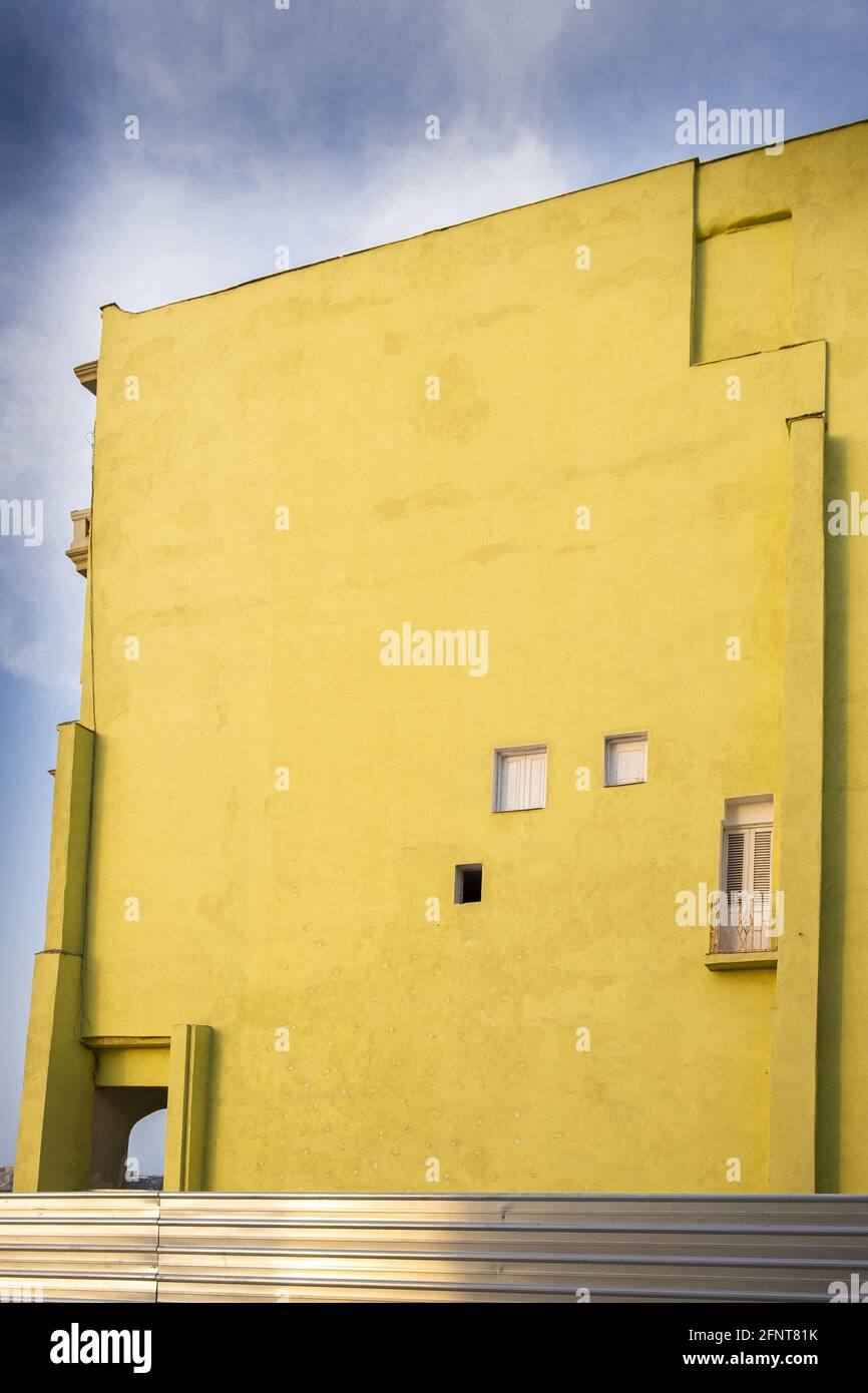 Building with yellow walls and modern exterior Stock Photo - Alamy