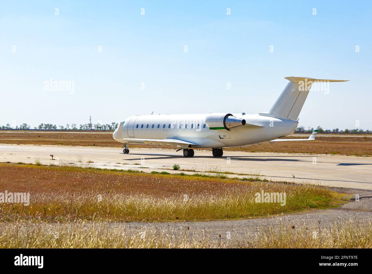 Big passenger airplane drives along the runway in airport Stock Photo ...