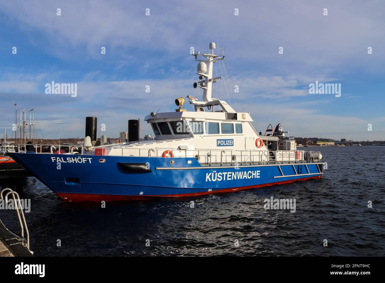 German police boat moored at the port of Kiel in Germany on a sunny day ...