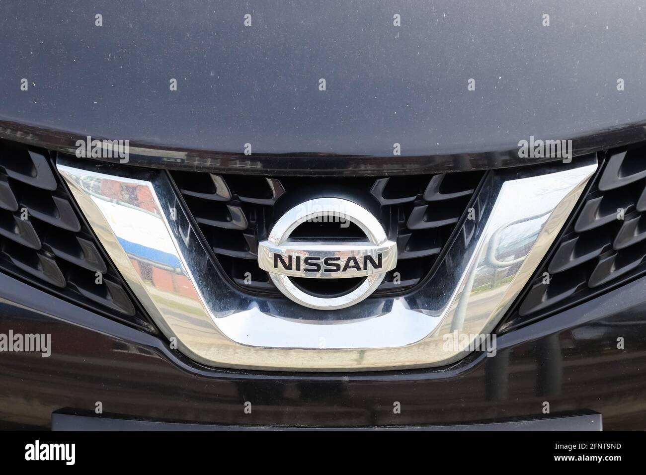Closeup of the Nissan logo on a new car front Stock Photo - Alamy