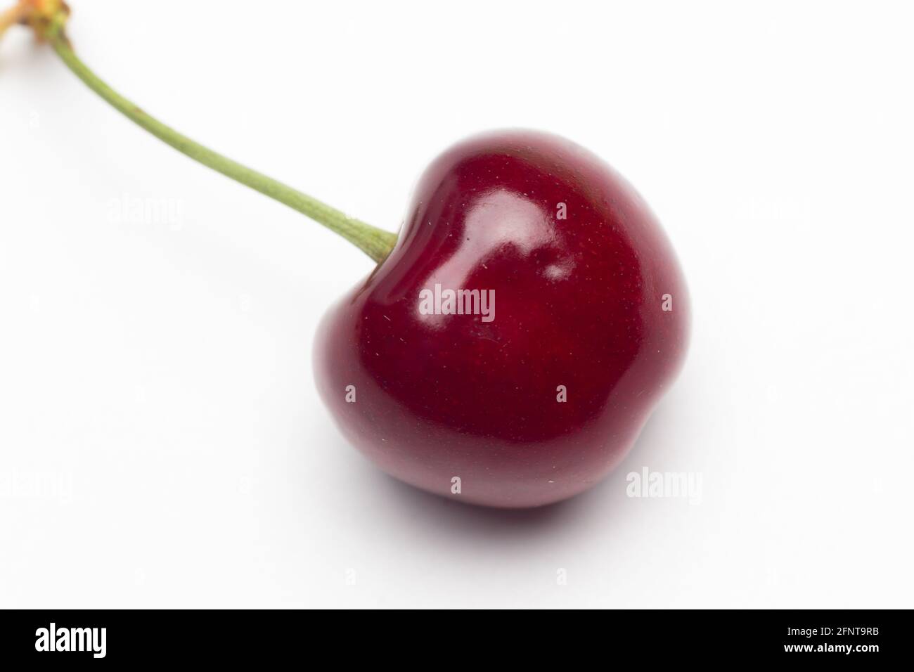 set of small red cherries on a white background full of vitamins and ...