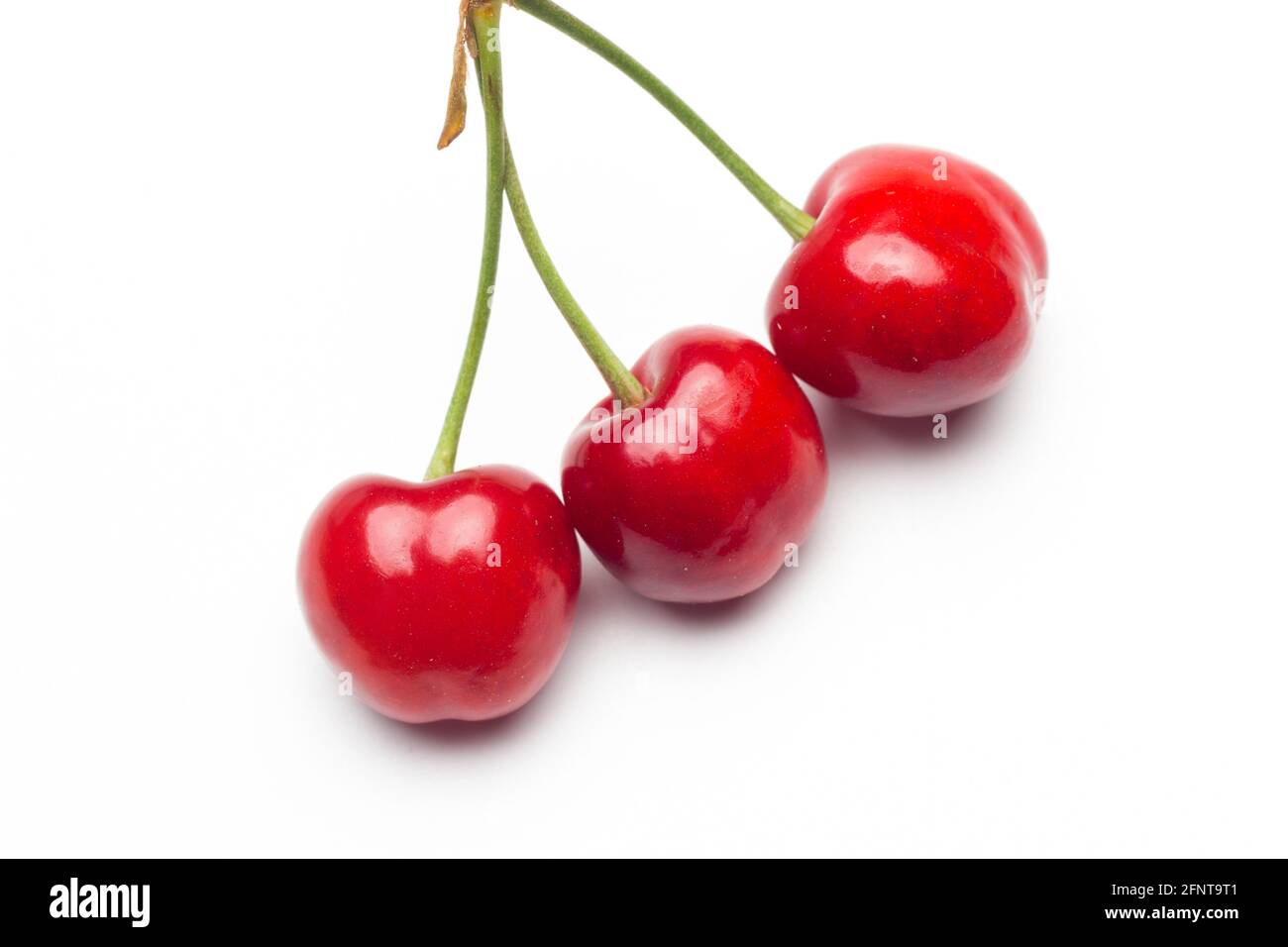 set of small red cherries on a white background full of vitamins and ...