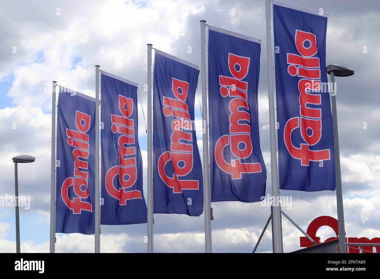 Flags with the logo of Famila, a German discount store chain Stock ...