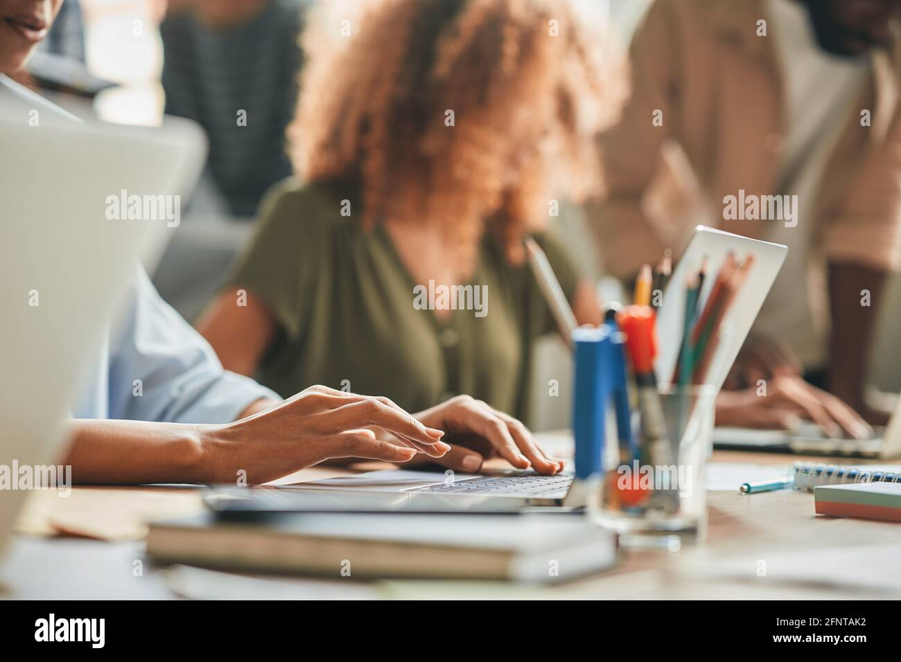 Hard-working person typing while working on the laptop Stock Photo - Alamy