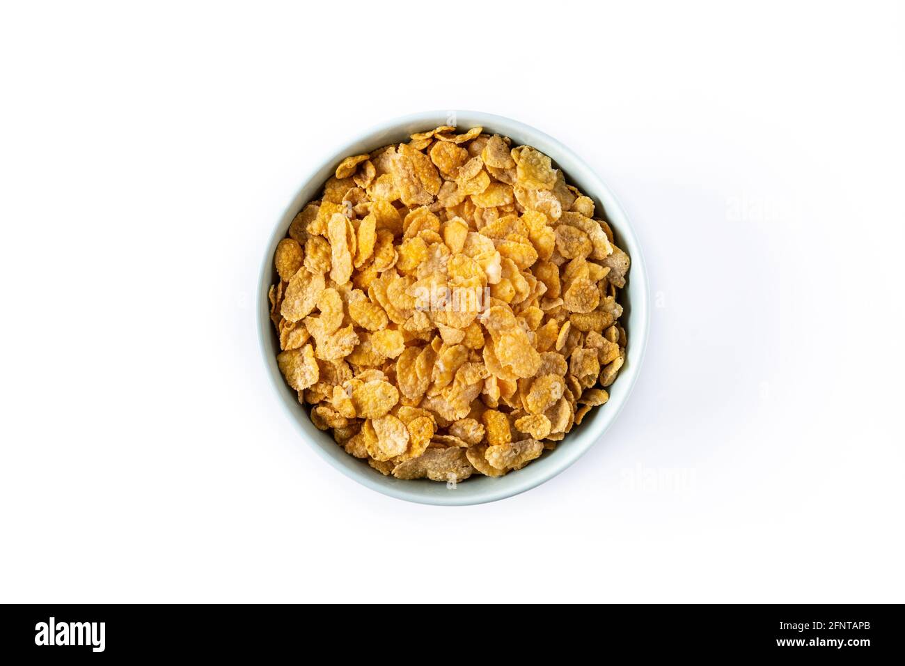 Corn flakes in a blue bowl isolated on white background Stock Photo - Alamy