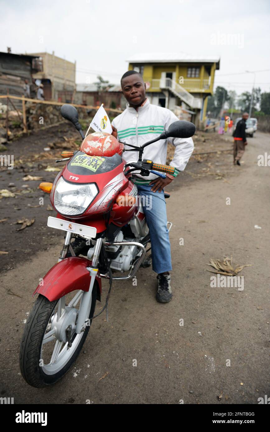 A motorbike taxi driver in Goma, North Kivu province, D.R.C Stock Photo ...