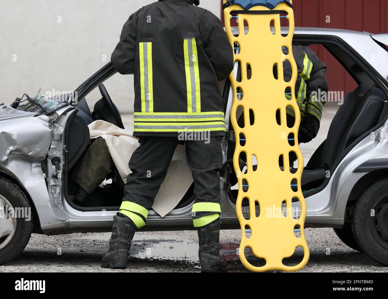 Firefighters rescue an injured person after the incredible fatal ...