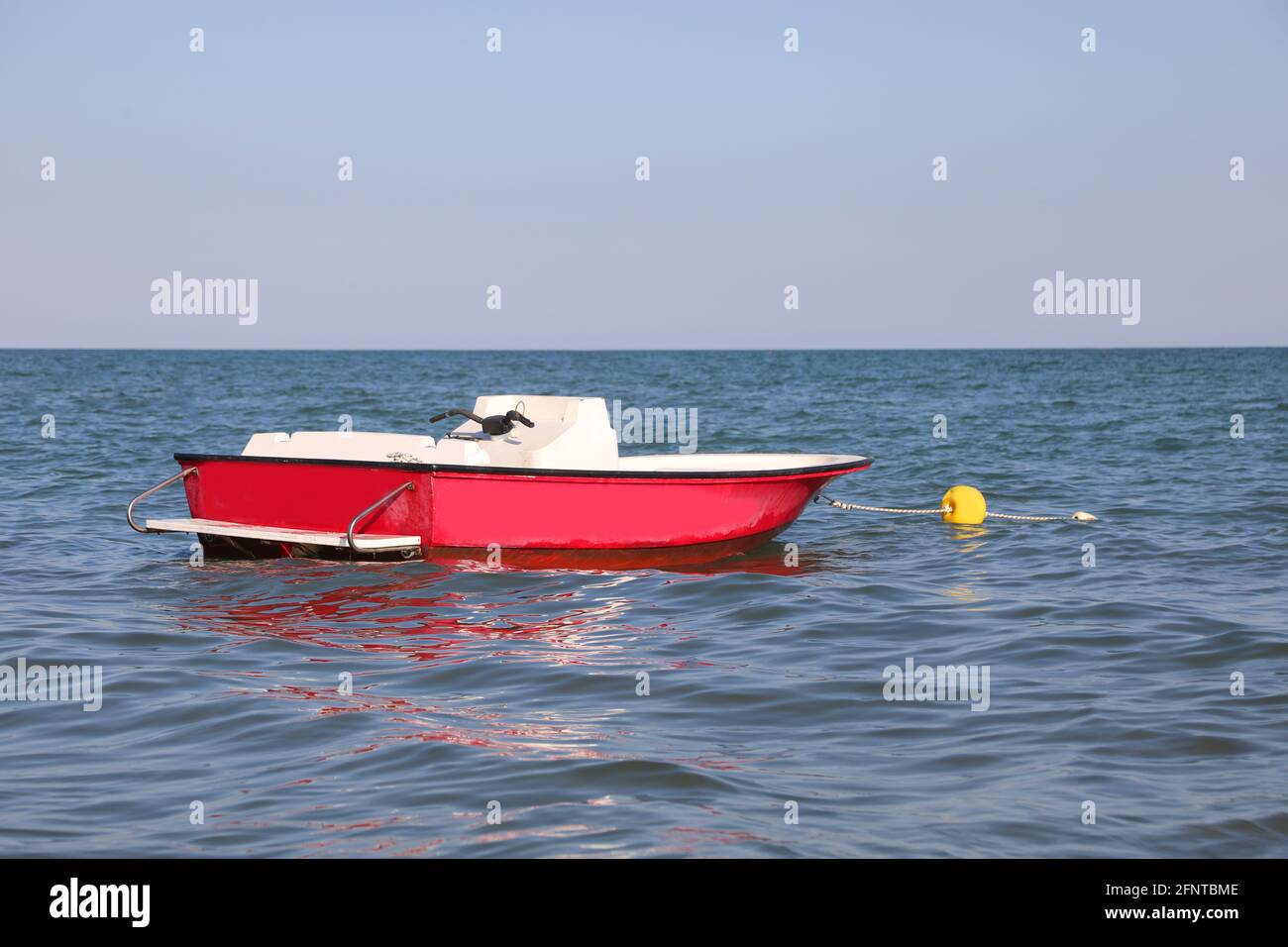 red motorboat in the middle of the sea to rescue swimmers Stock Photo ...