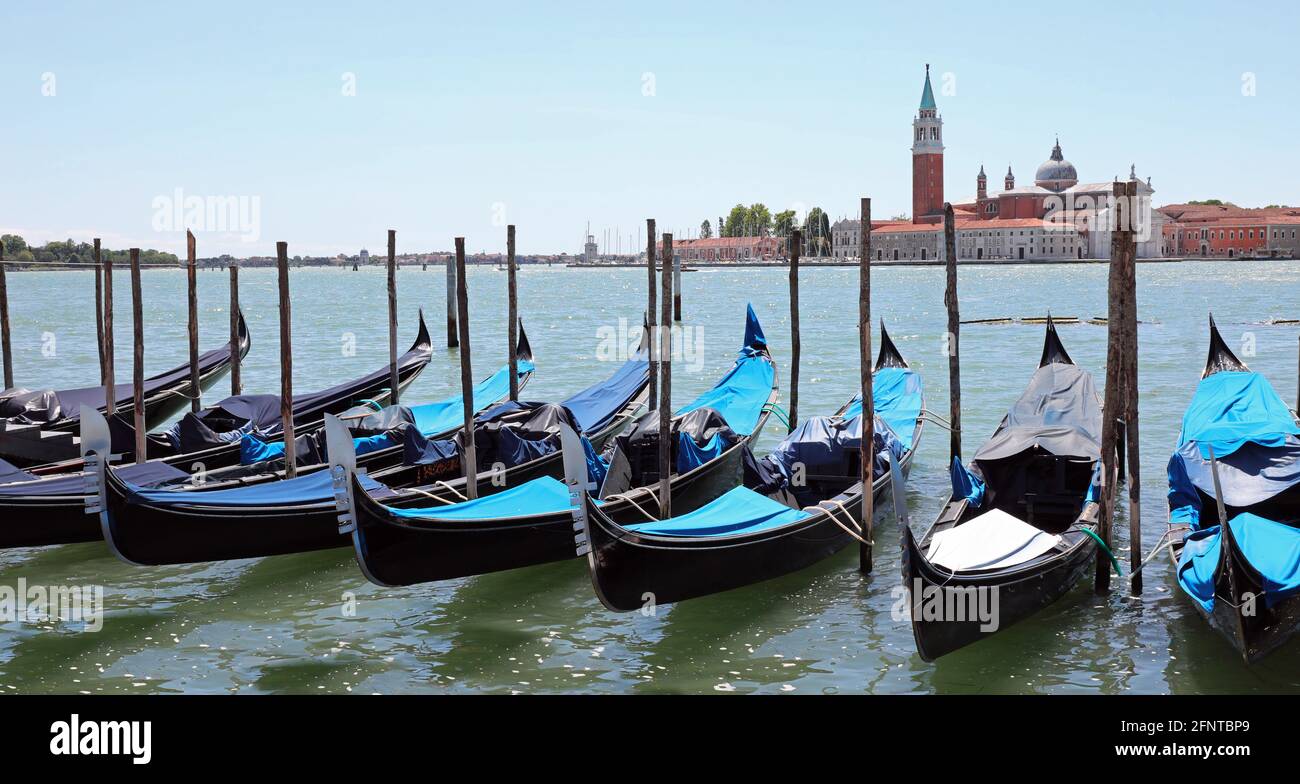 gondolas typical Venetian boats moored in the Giudecca canal in front ...