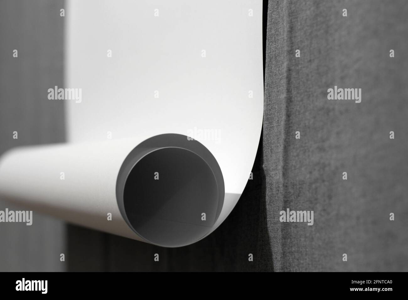 White paper in a roll. Paper on the wall Stock Photo - Alamy