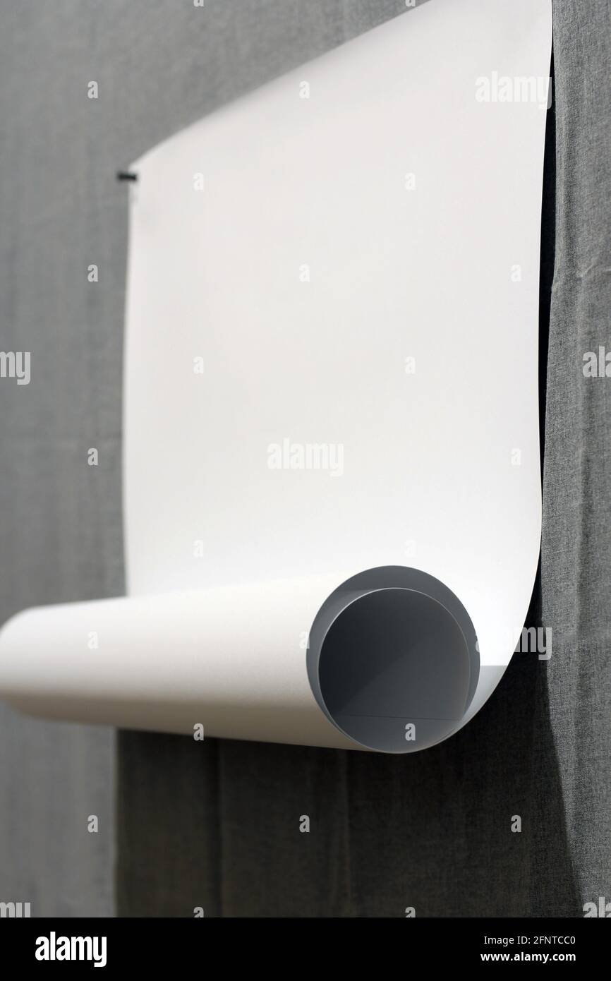 White paper in a roll. Paper on the wall Stock Photo - Alamy