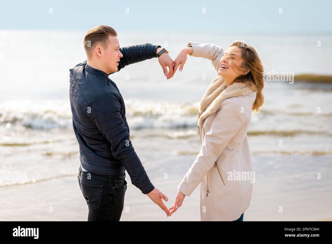Girl making heart shape arms hi-res stock photography and images - Alamy