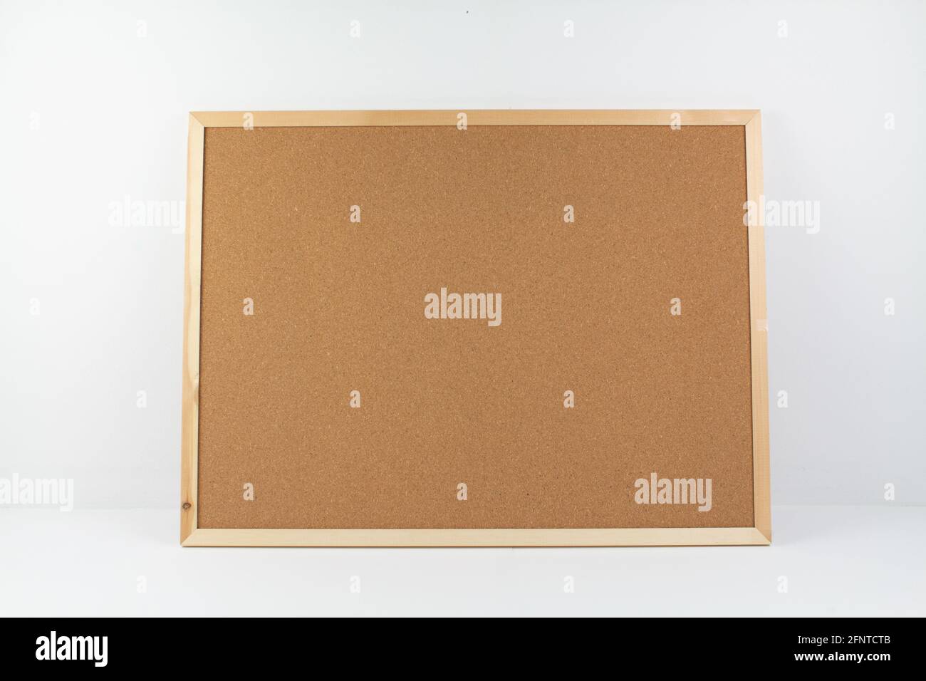 a cork board for notes on white background Stock Photo - Alamy