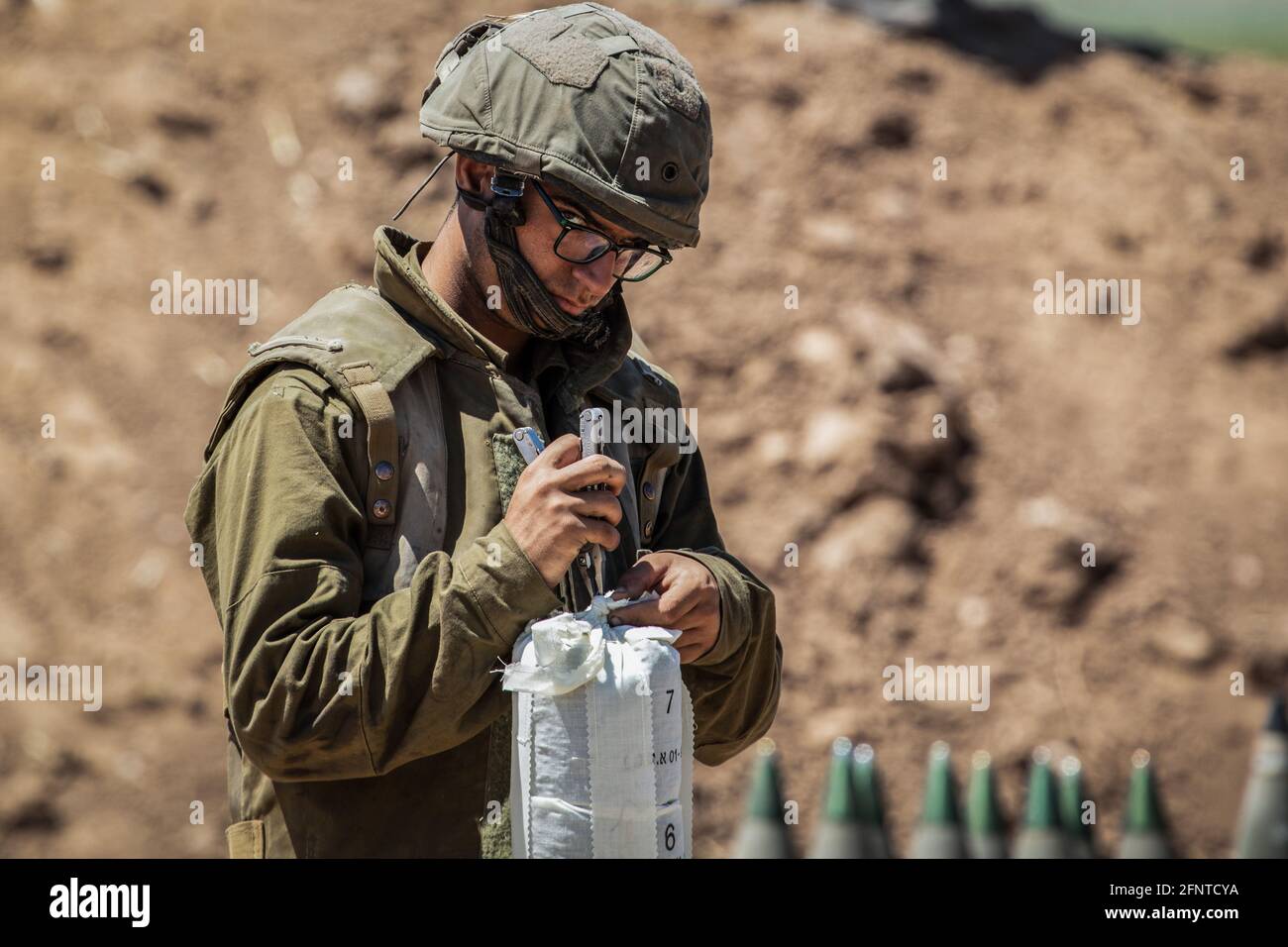 Sderot, Israel. 19th May, 2021. An Israeli soldier prepares propelled ...