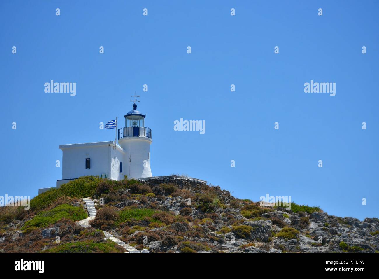 Landscape with panoramic view of the historic Lighthouse in Kapsali Bay ...