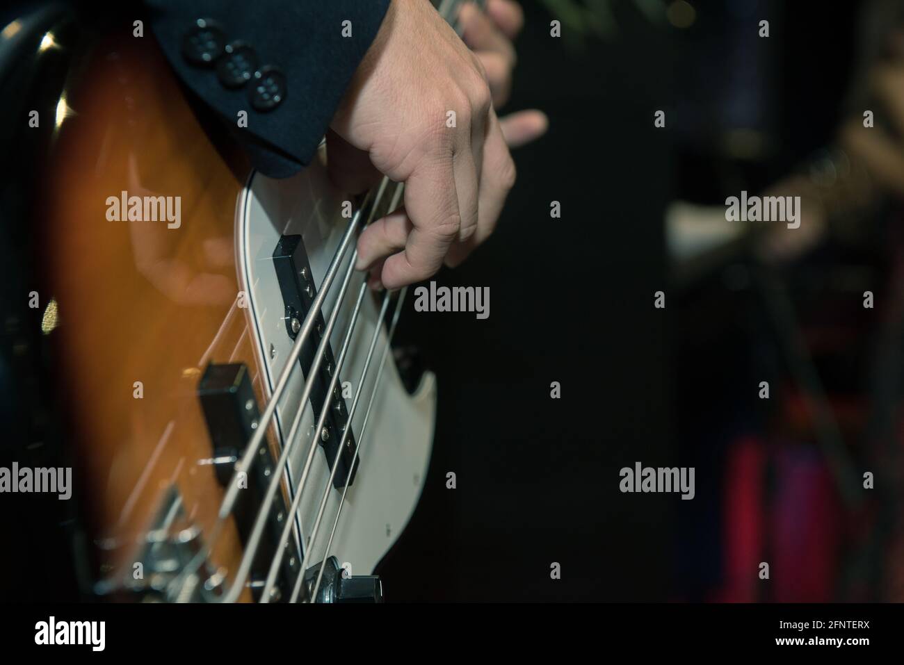 Man playing bass in low tone Stock Photo - Alamy