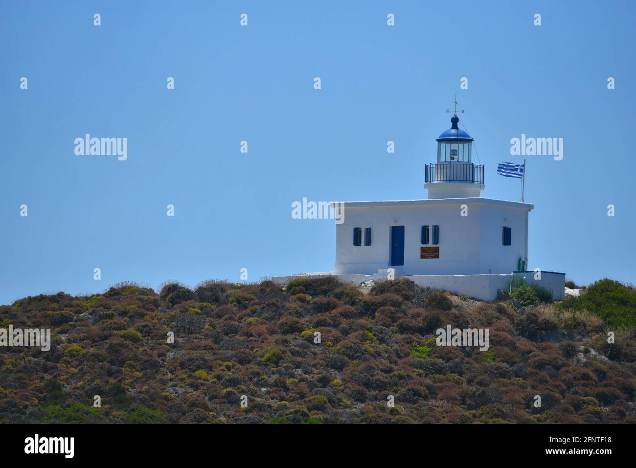 Landscape with panoramic view of the historic Lighthouse in Kapsali Bay ...