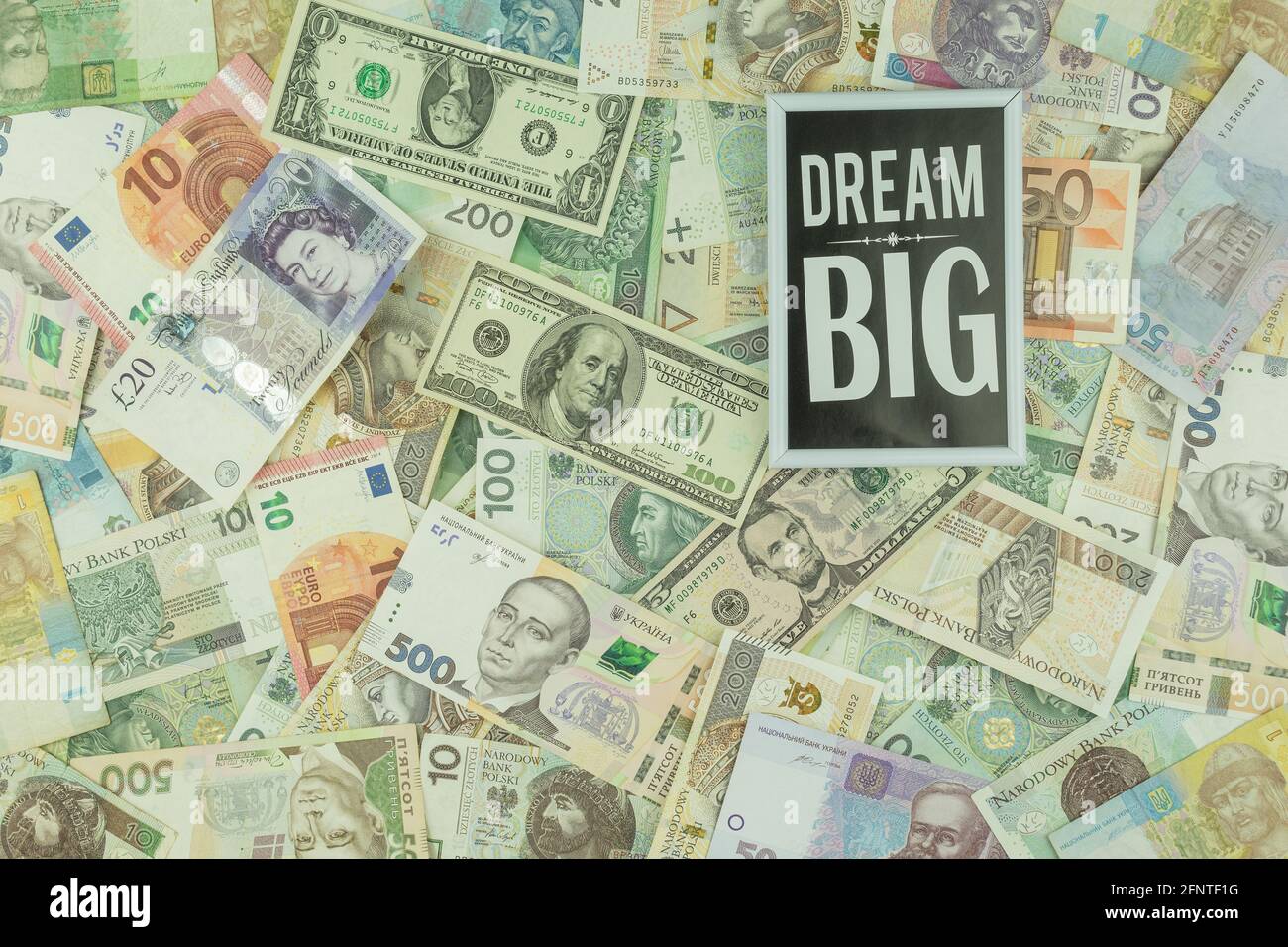 Banknotes of different denominations are scattered on the table. Wish ...