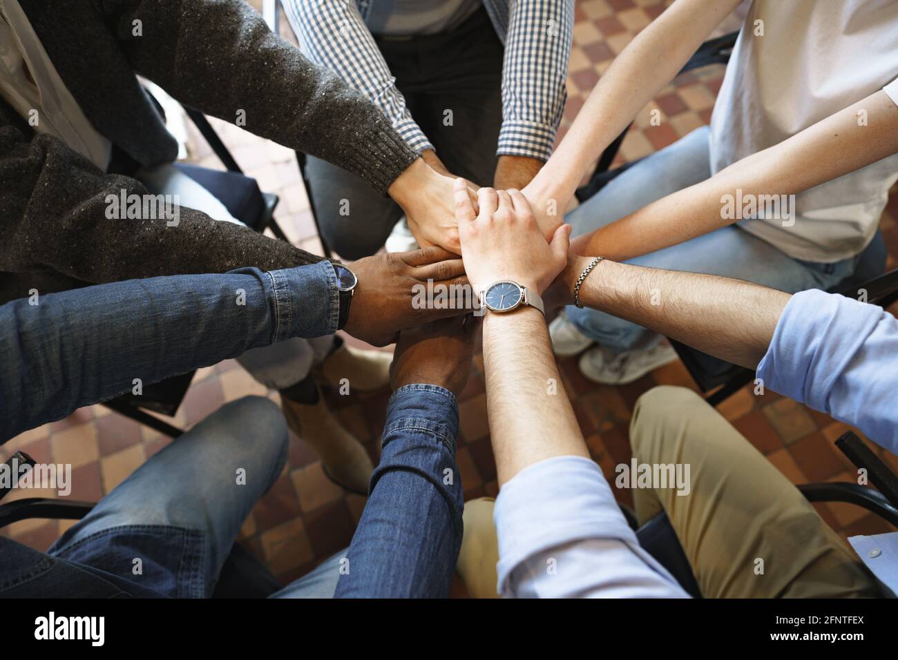 Top view of diverse people hands holding together in circle, hands ...