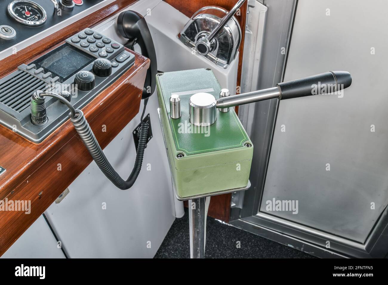 From above steering lever located near dashboard with radio in cockpit ...
