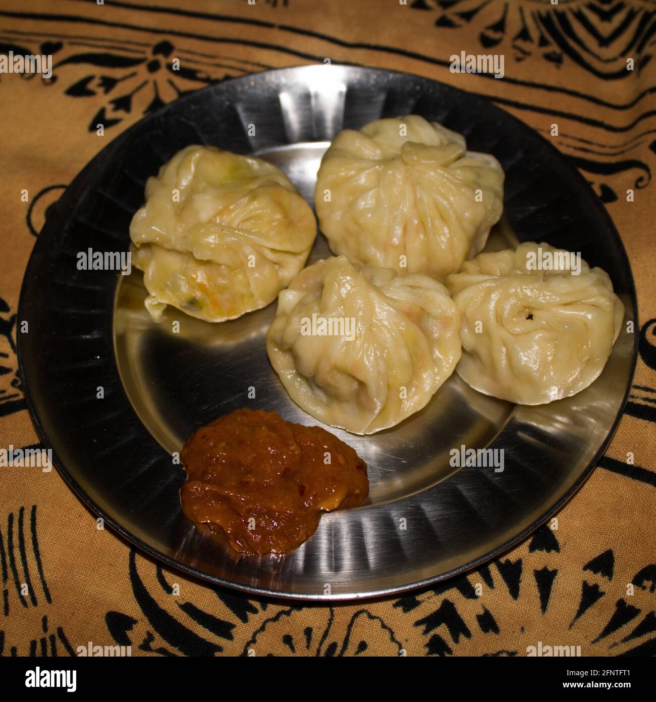 closeup of spicy momo with red chilli sauce Stock Photo - Alamy