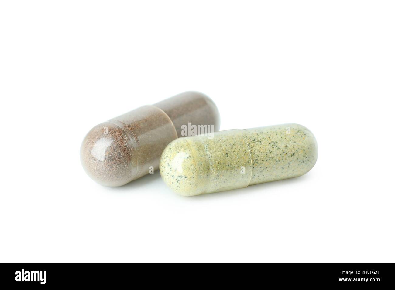 Herbal powder capsules isolated on white background Stock Photo - Alamy