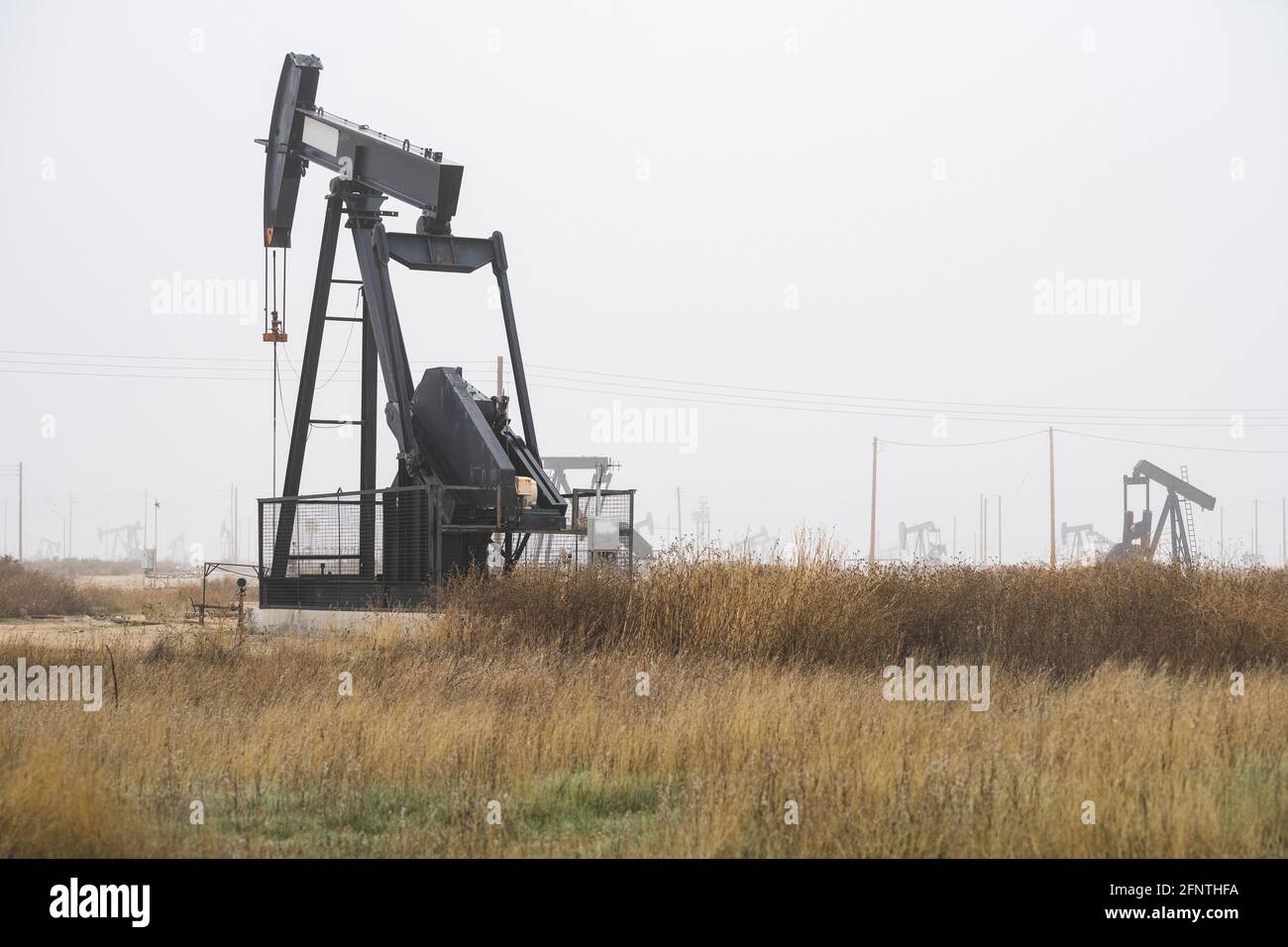 Oil well pump in the field Stock Photo - Alamy
