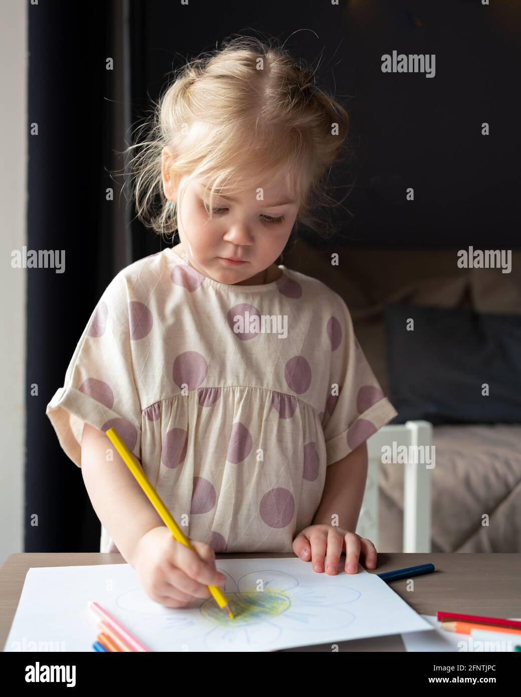 Charming little preschool child girl with golden hair in linen dress ...