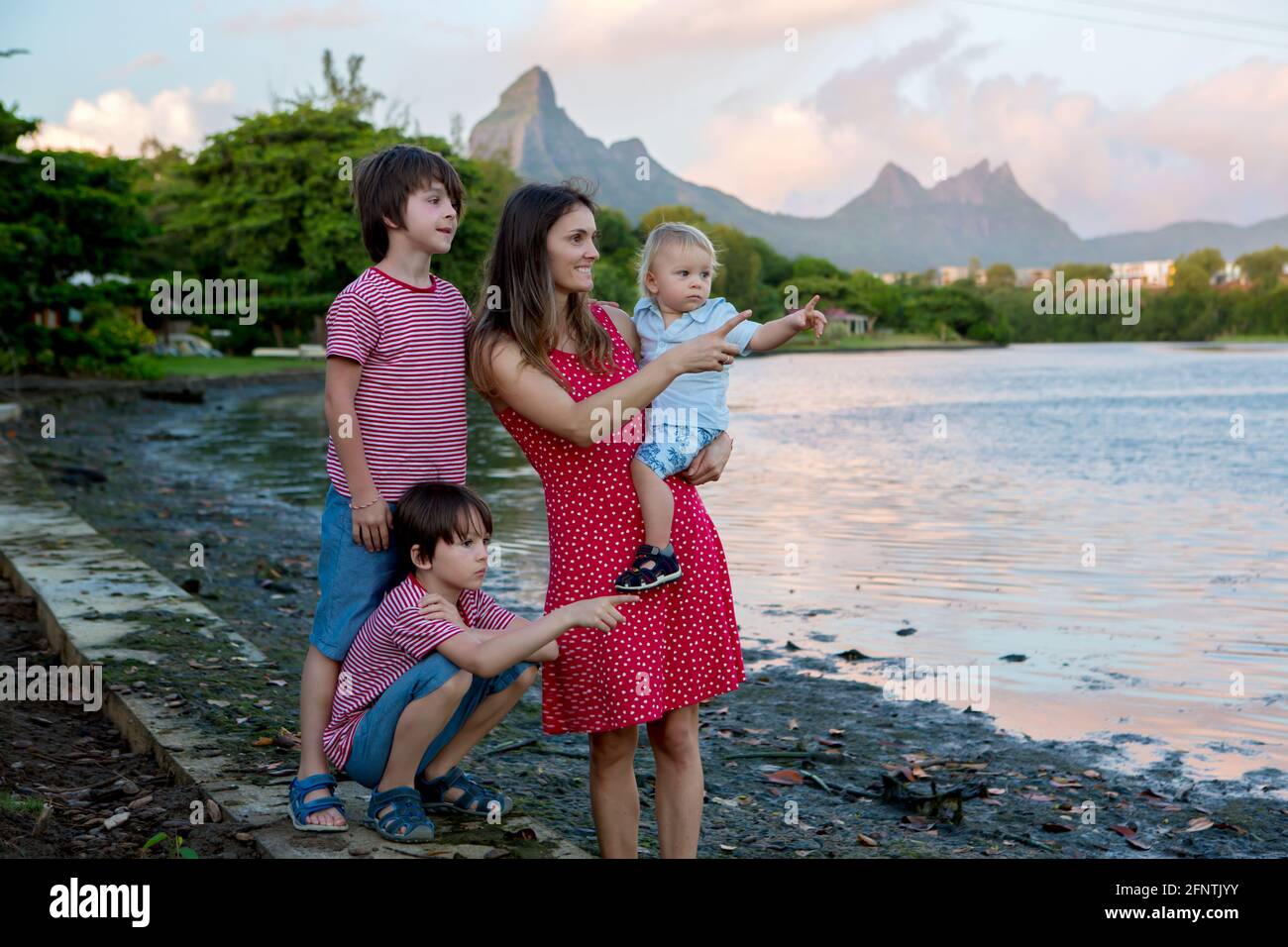 Happy family, parents and children, enjoying aerial view of wild ...