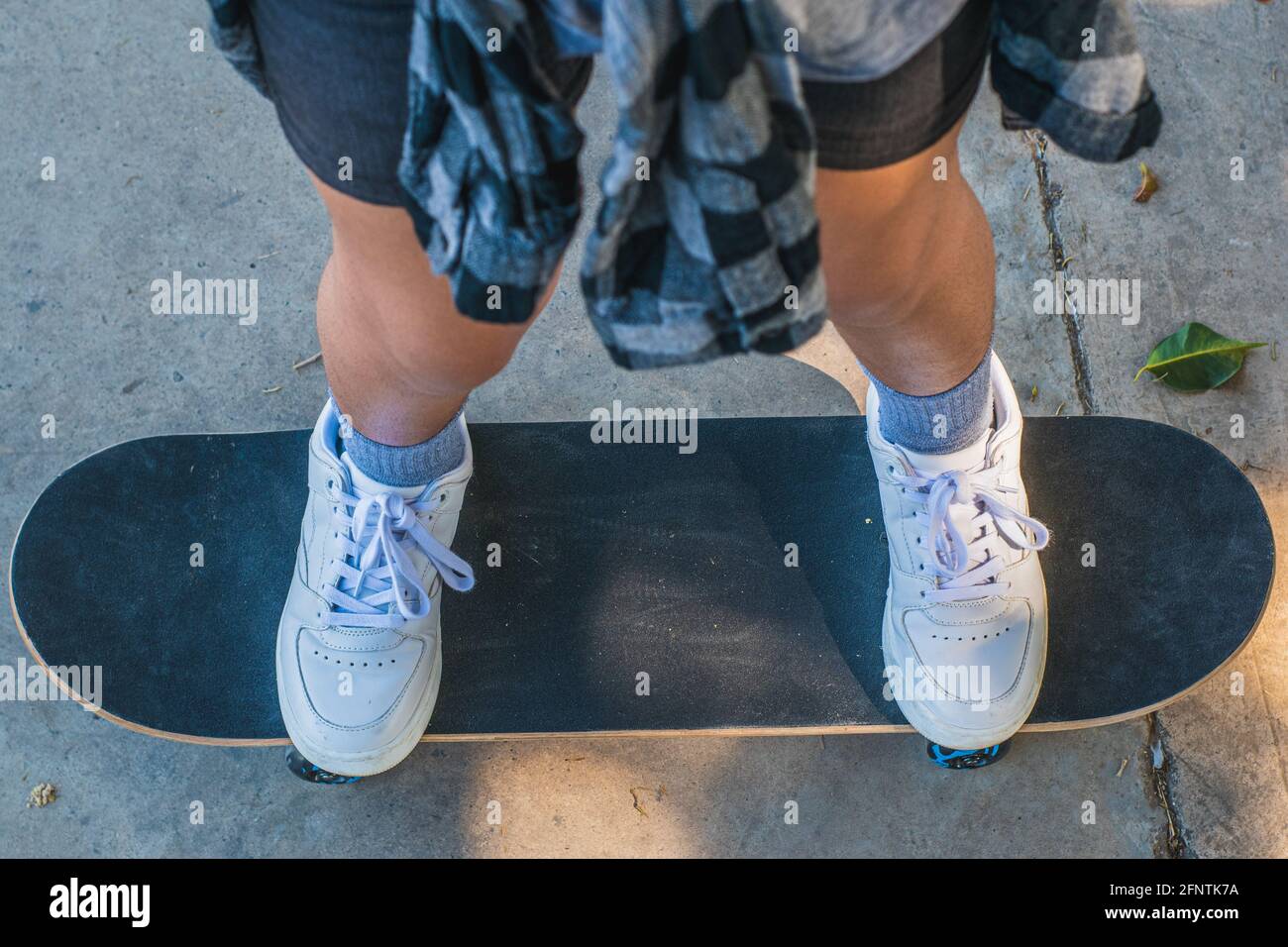 Shot of a girl's feet as she skates on her skateboard Stock Photo - Alamy