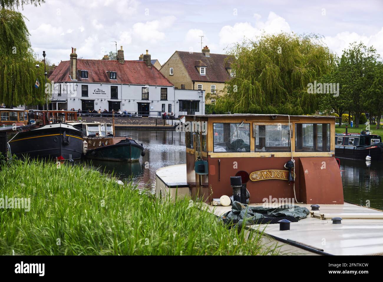 Cottages and barges in springtime looking towards the Cutter Inn ...