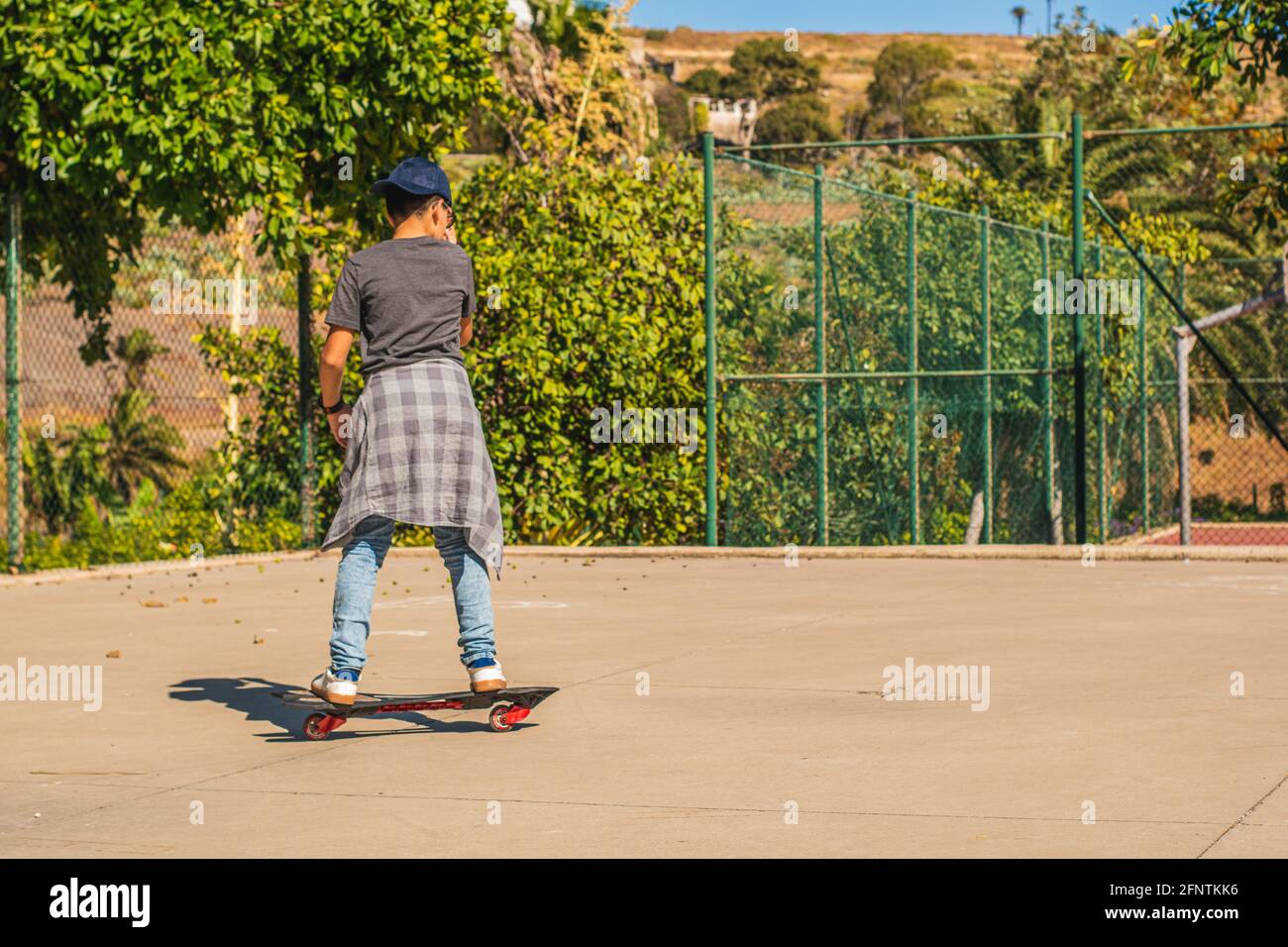 Boy on his back skating with his skateboard in a skate park Stock Photo ...