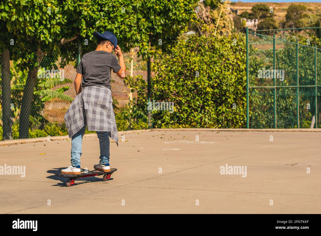 Boy on his back skating with his skateboard in a skate park Stock Photo ...