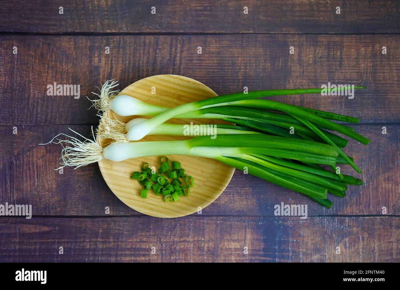 Spring onions with roots hi-res stock photography and images - Alamy