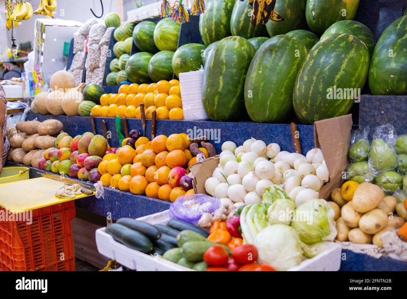 Colorful fruit stand with watermelons, oranges, mangoes, and more Stock ...