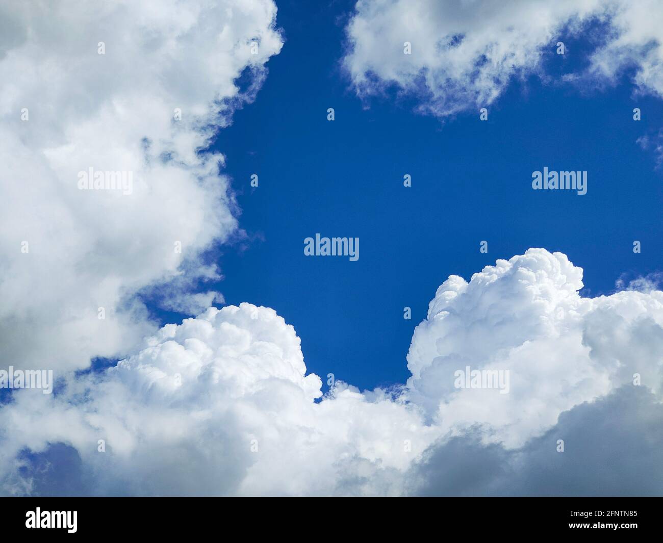 Windy clouds on blue sky Stock Photo - Alamy