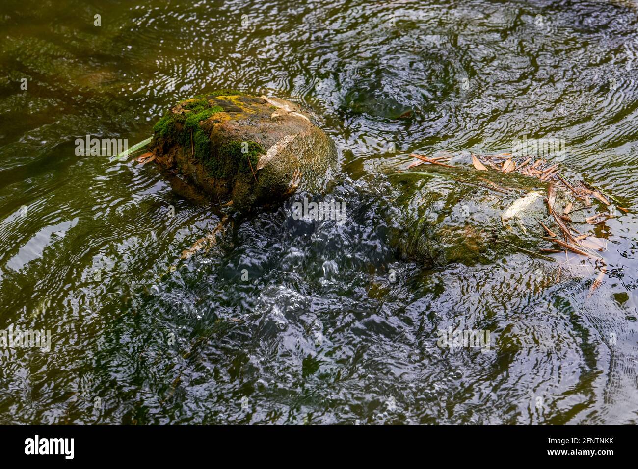 The water hit the stone Stock Photo - Alamy