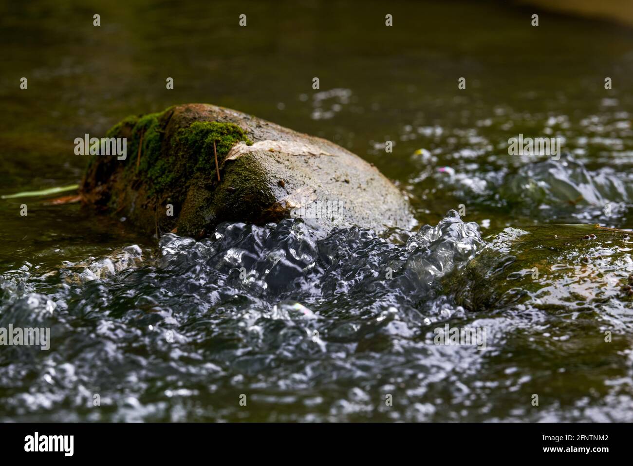 The water hit the stone Stock Photo - Alamy