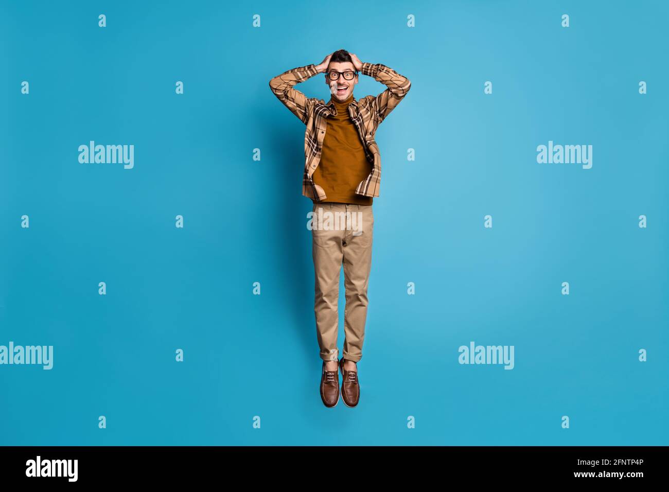Full size photo of young happy excited amazed shocked man jumping on ...