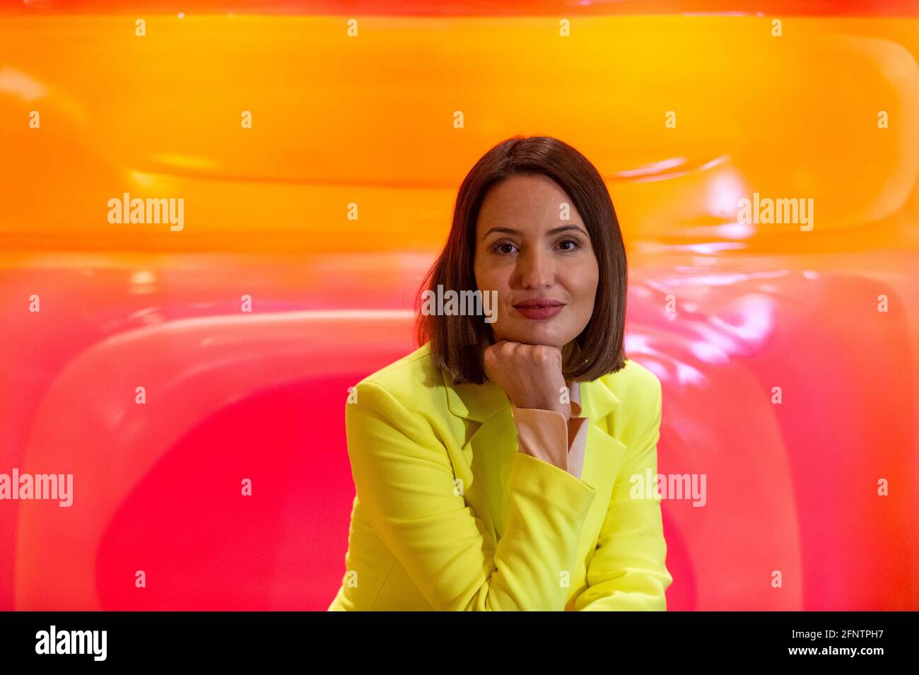 London, UK. 19 May 2021. Abstract artist Nat Bowen’ poses with her work ...
