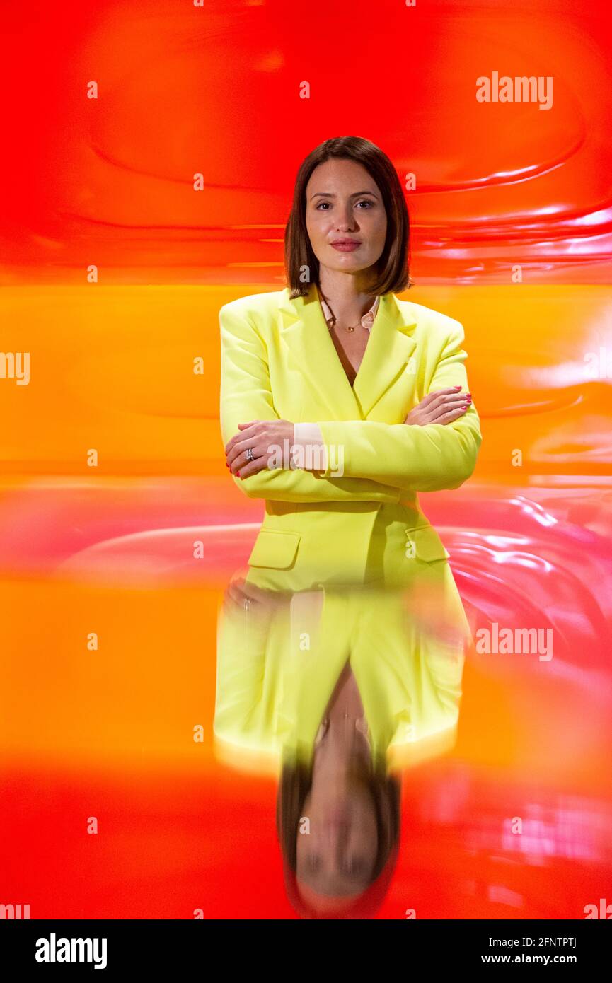 London, UK. 19 May 2021. Abstract artist Nat Bowen’ poses with her work ...