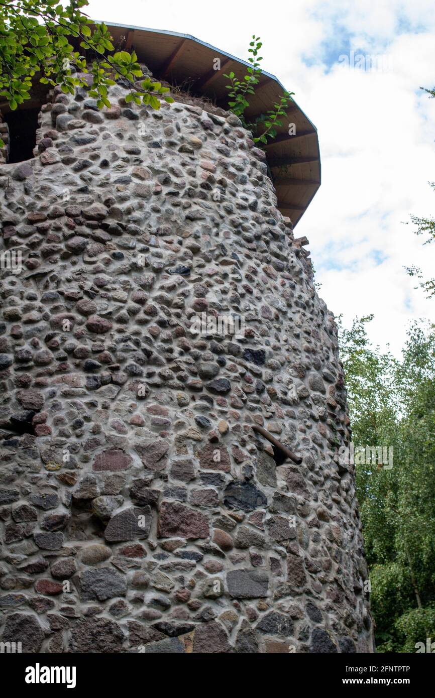 Vertical shot of a circular stone construction surrounded by trees ...