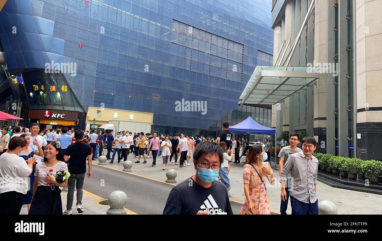 SHENZHEN, CHINA - MAY 18, 2021 - People walk out of SEG Plaza in Shenzhen, south China's ...